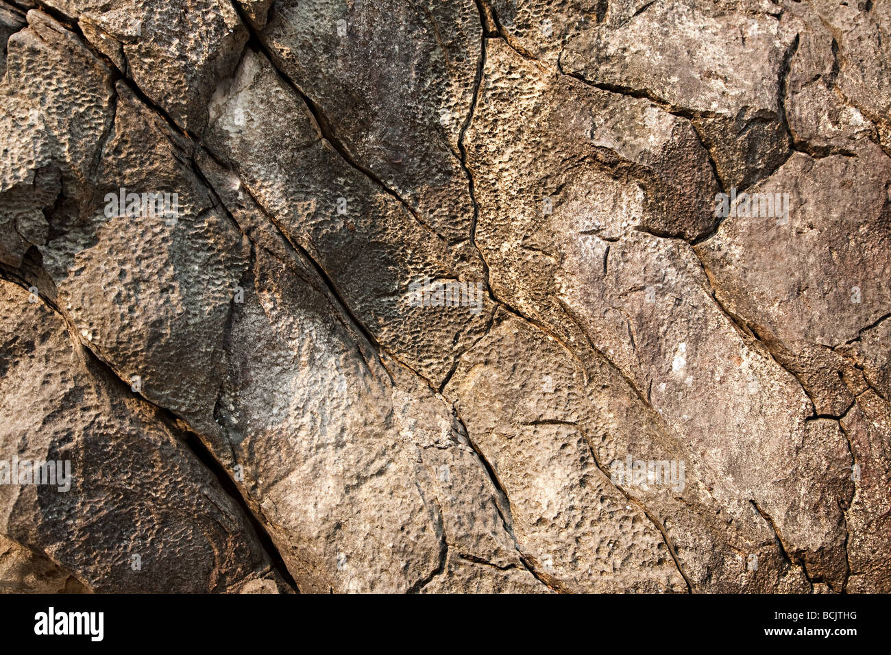 Close up image of cracked rocks Stock Photo - Alamy