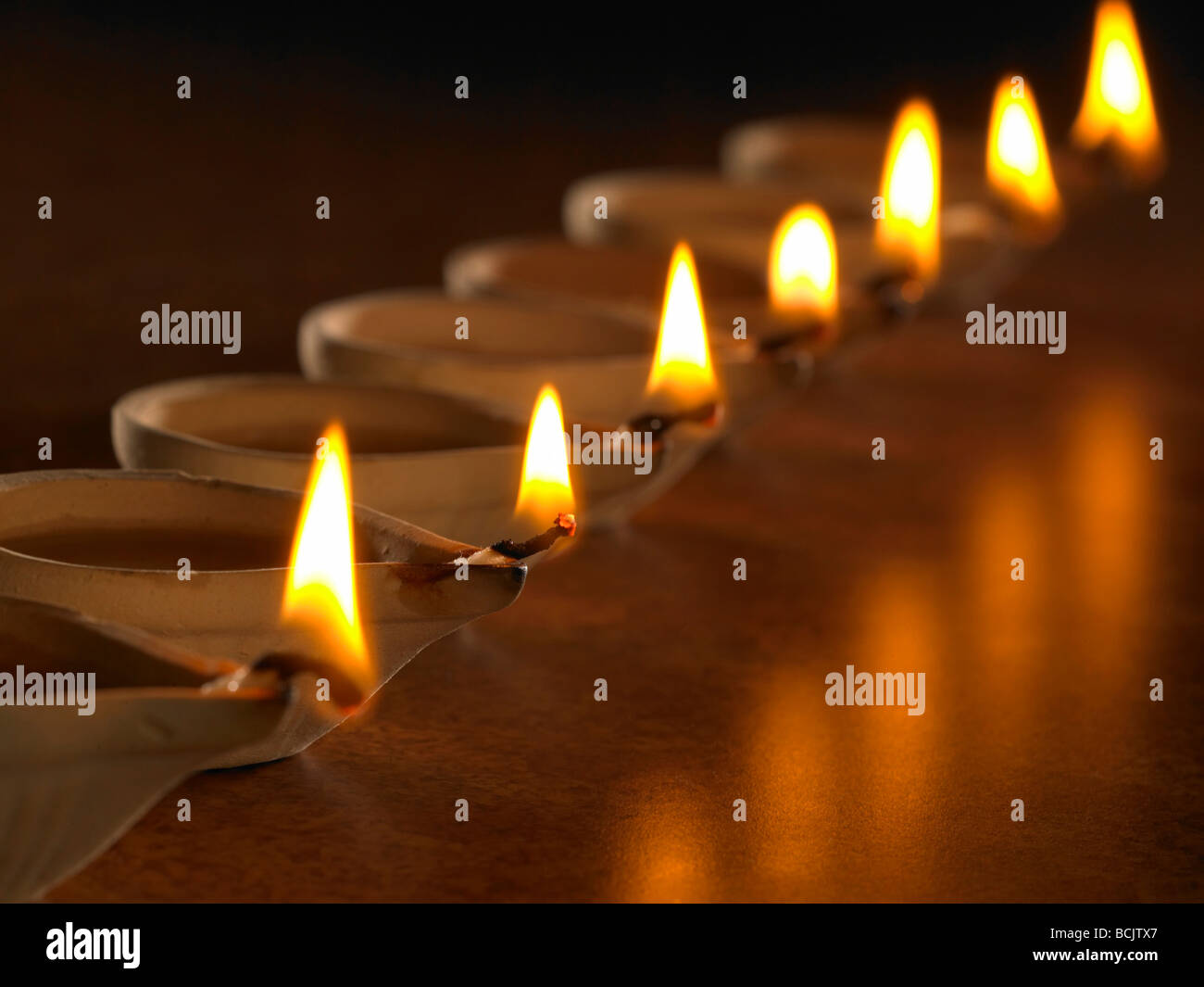 traditional indian oil lamp in a row Stock Photo - Alamy
