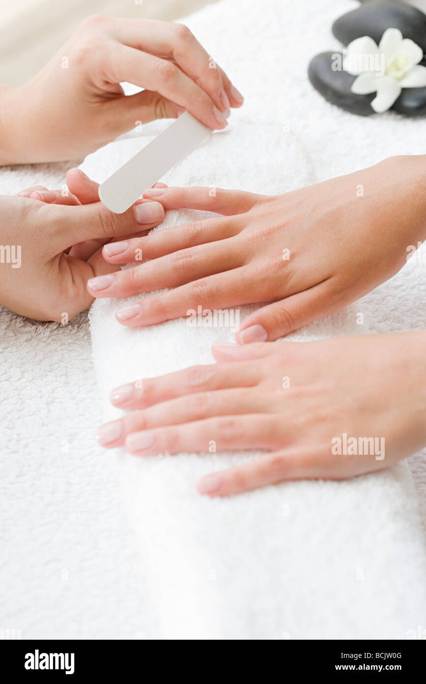 Woman getting a manicure Stock Photo - Alamy