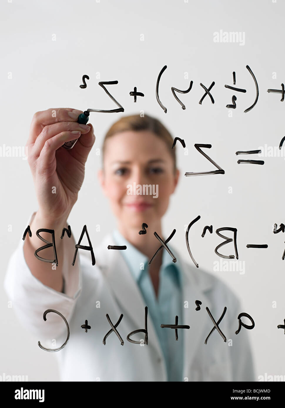 Scientist writing a formula Stock Photo - Alamy