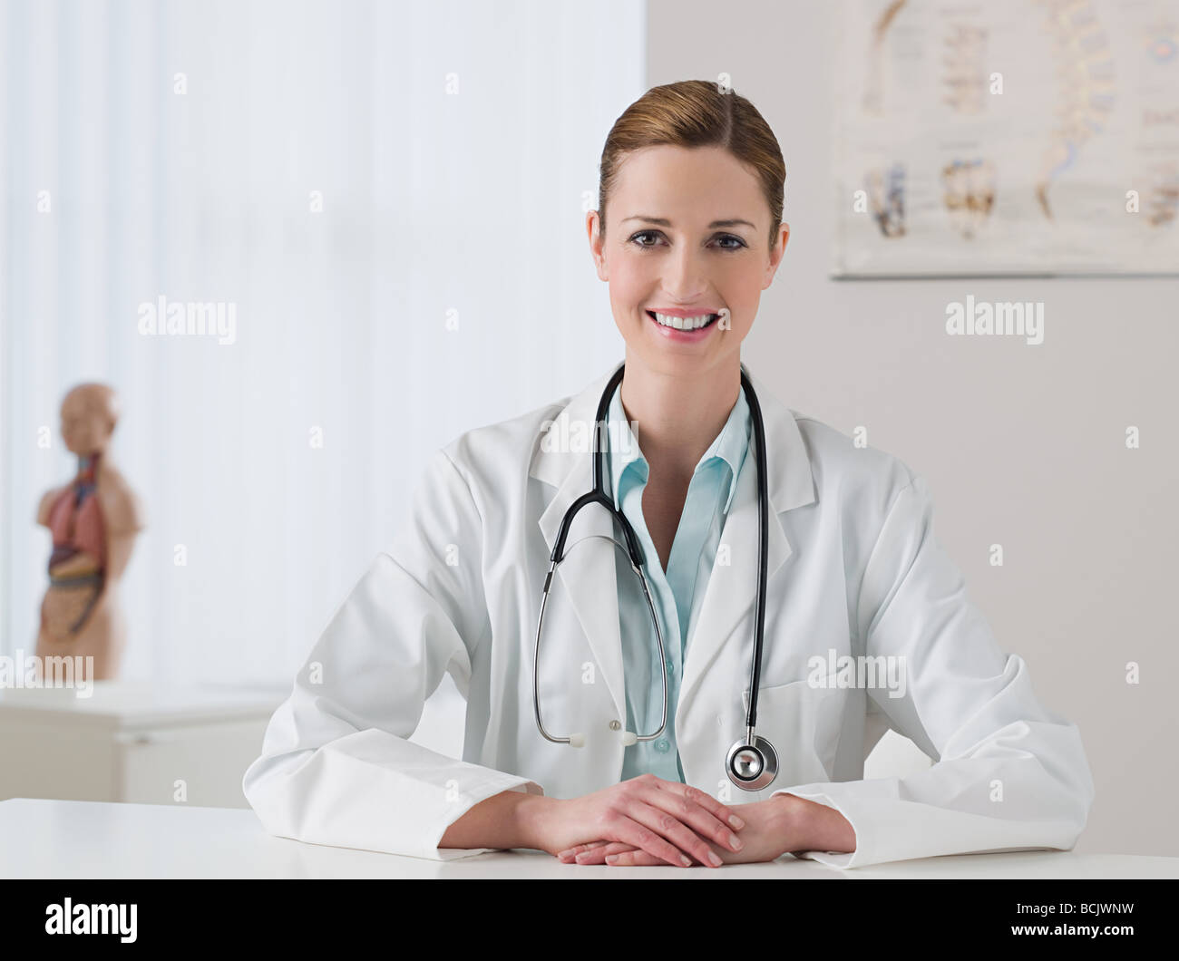 Smiling female doctor Stock Photo - Alamy