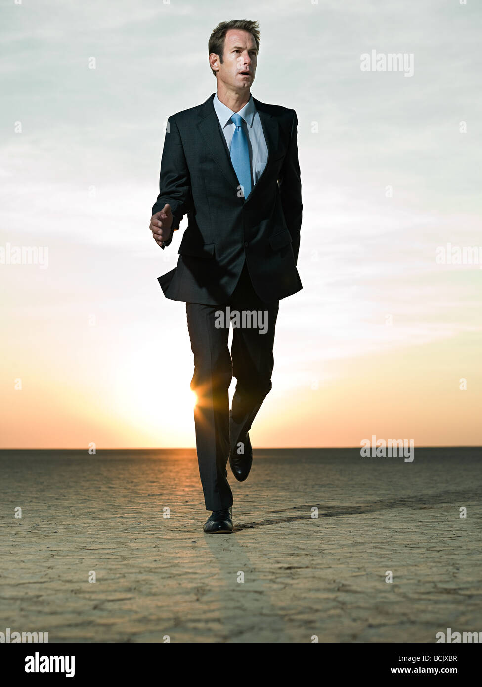 Man in suit running hi-res stock photography and images - Alamy