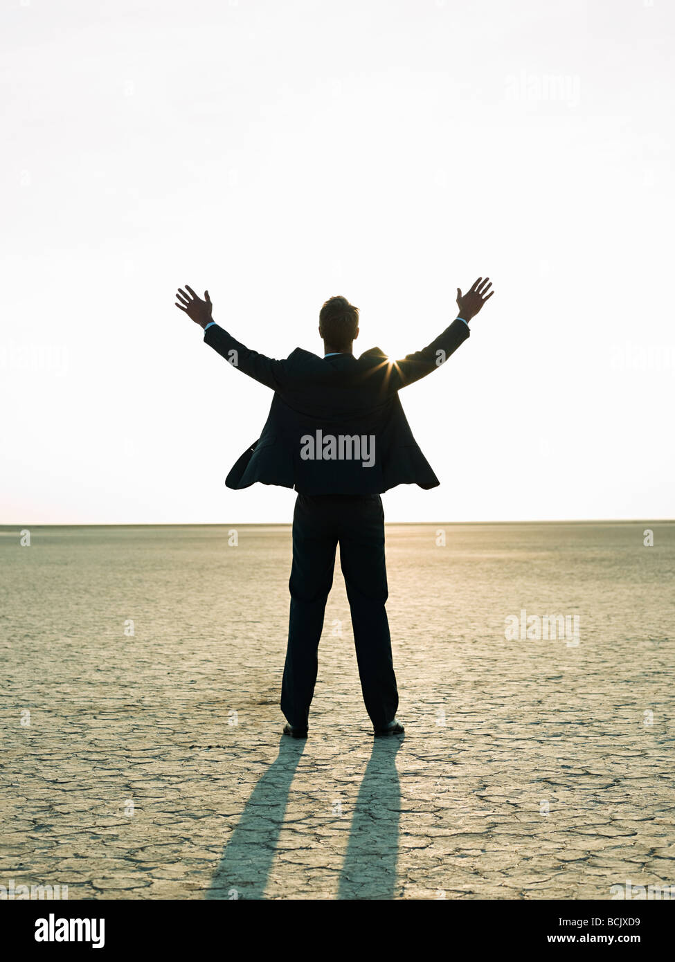 Businessman reaching to the sunlight Stock Photo - Alamy