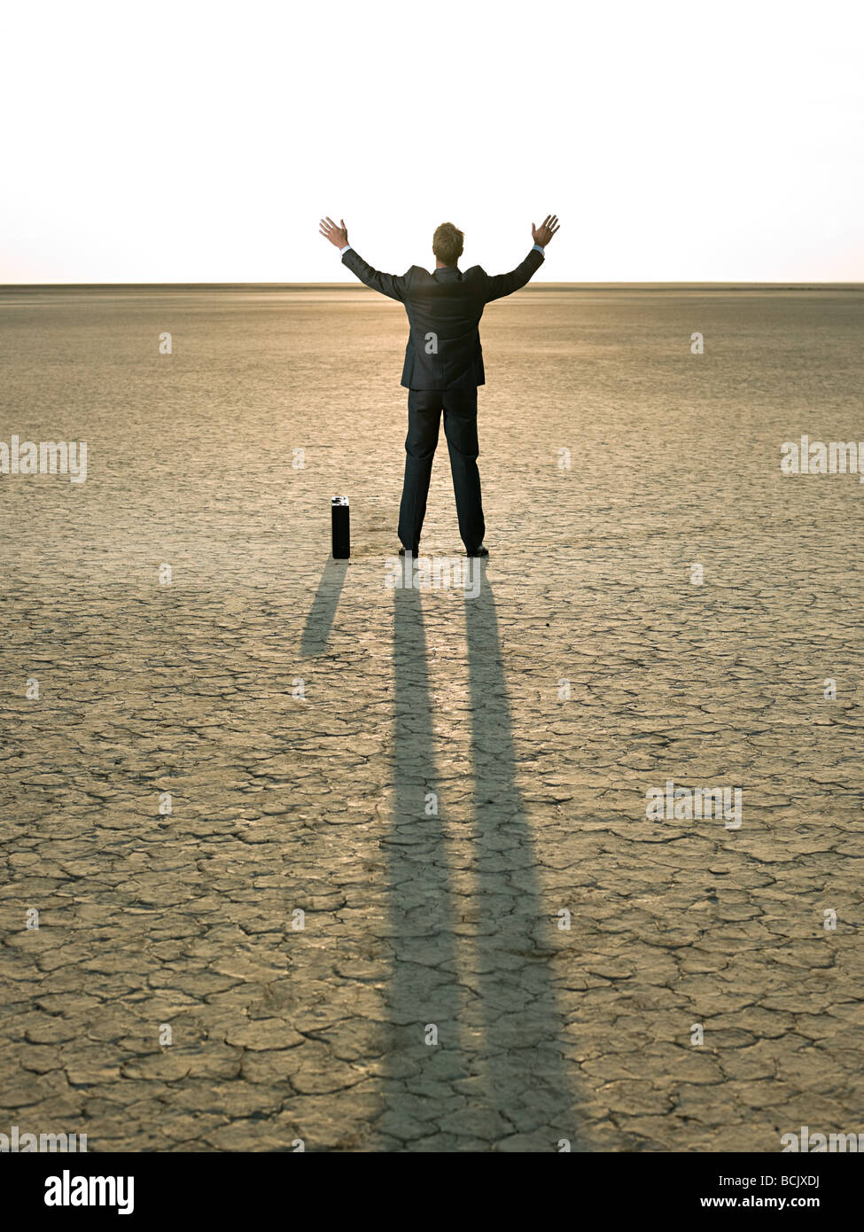 Businessman reaching to the sunlight Stock Photo - Alamy