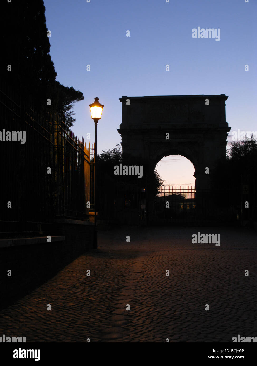 titus triumph victory arch in the roman forum illuminated at night ...