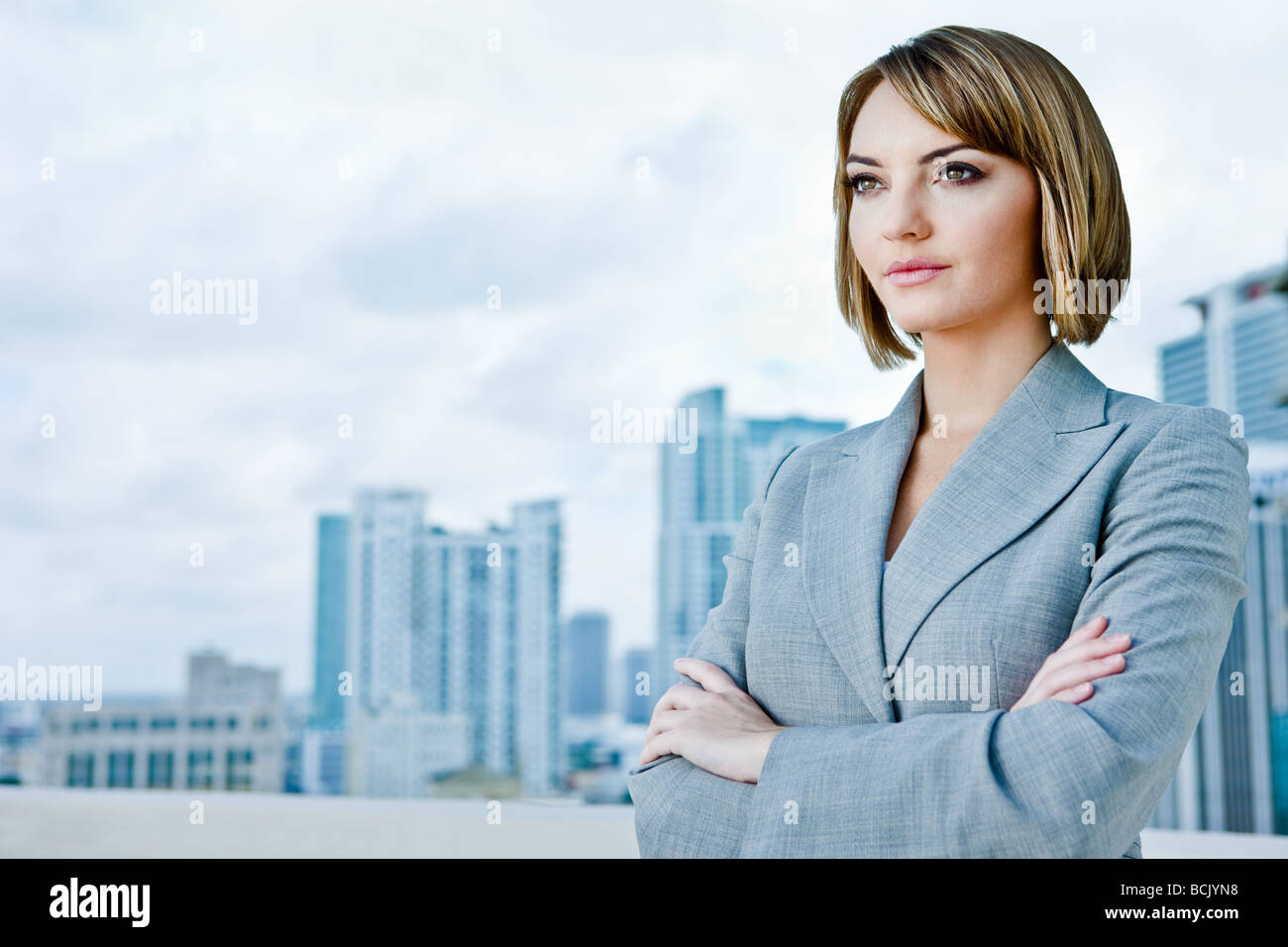 Attractive young business woman looking into distance see other file ...