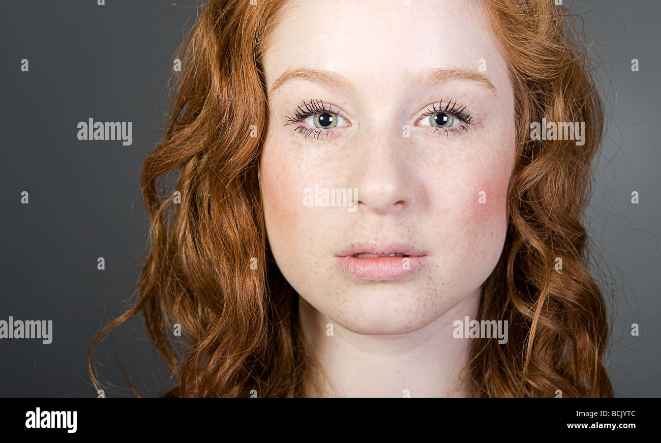 Studio Shot of a Stunning Red Headed Teenager against Grey Stock Photo ...