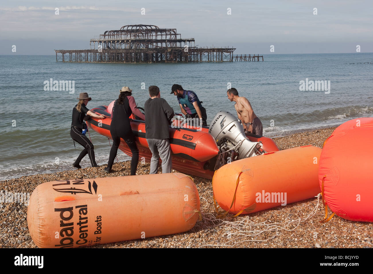 Sea safety speed boat complete with inflateable warning buoys being ...