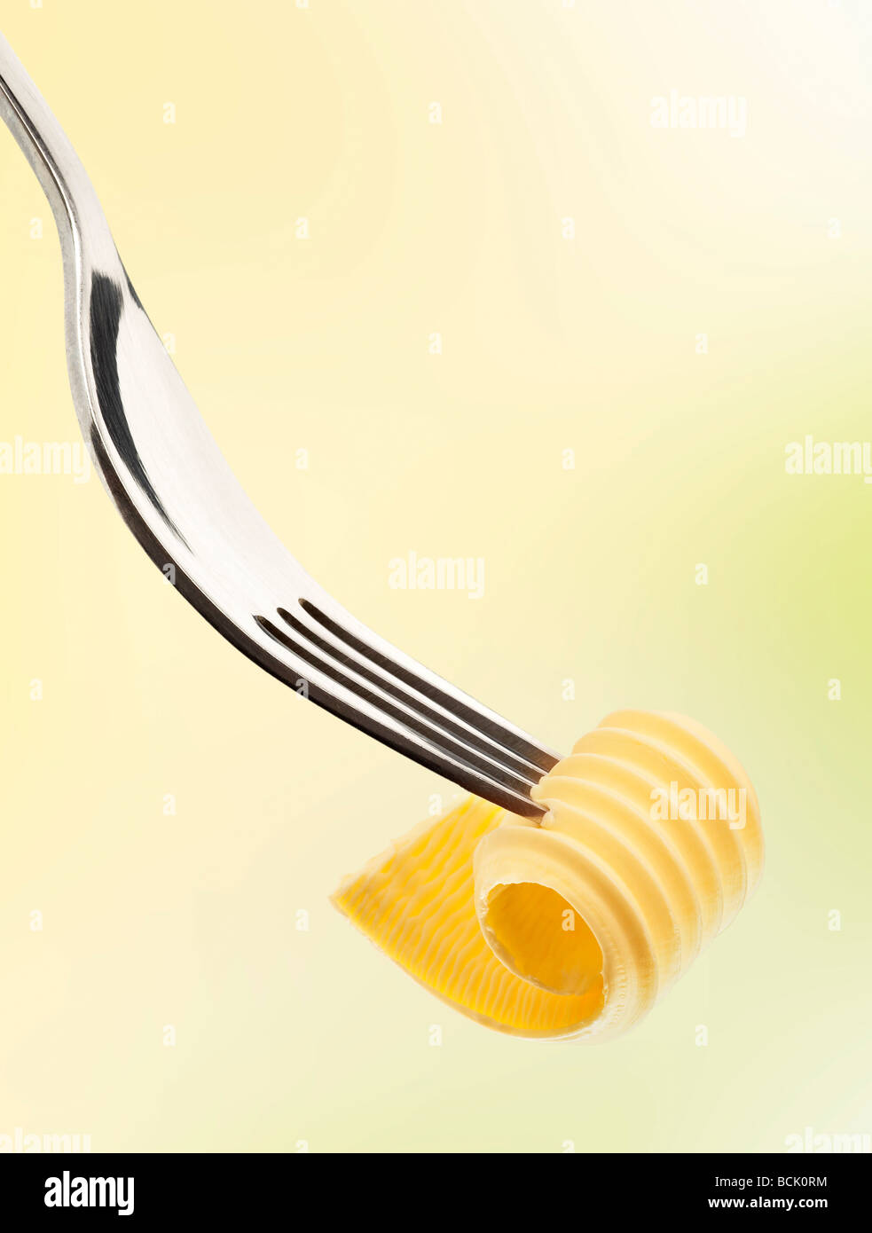 Butter curl on a fork Stock Photo - Alamy