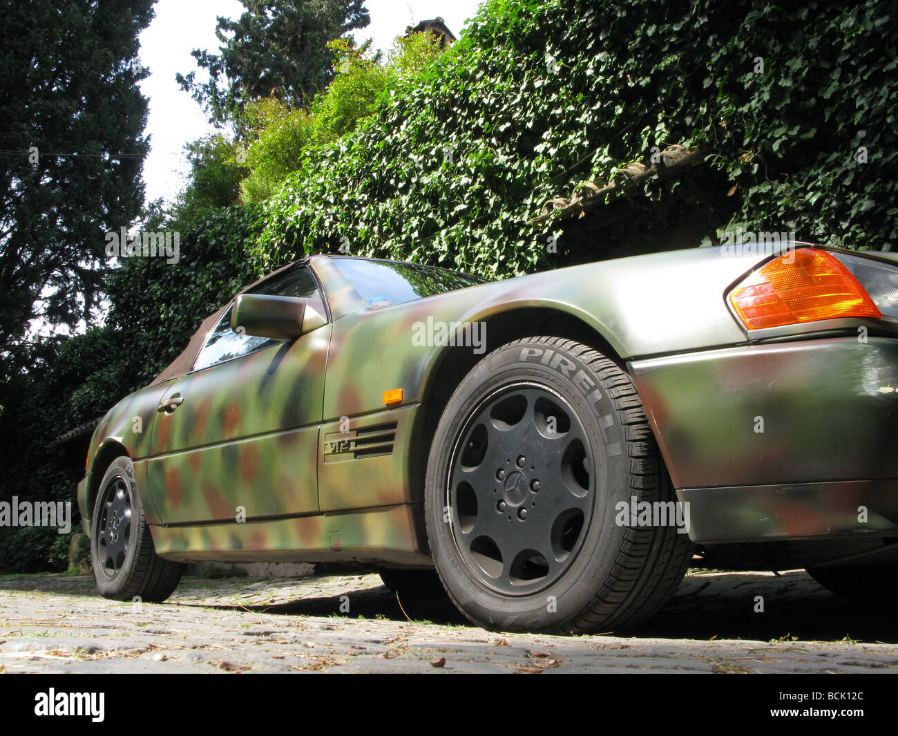 mercedes sports car painted with military army camouflage design Stock ...
