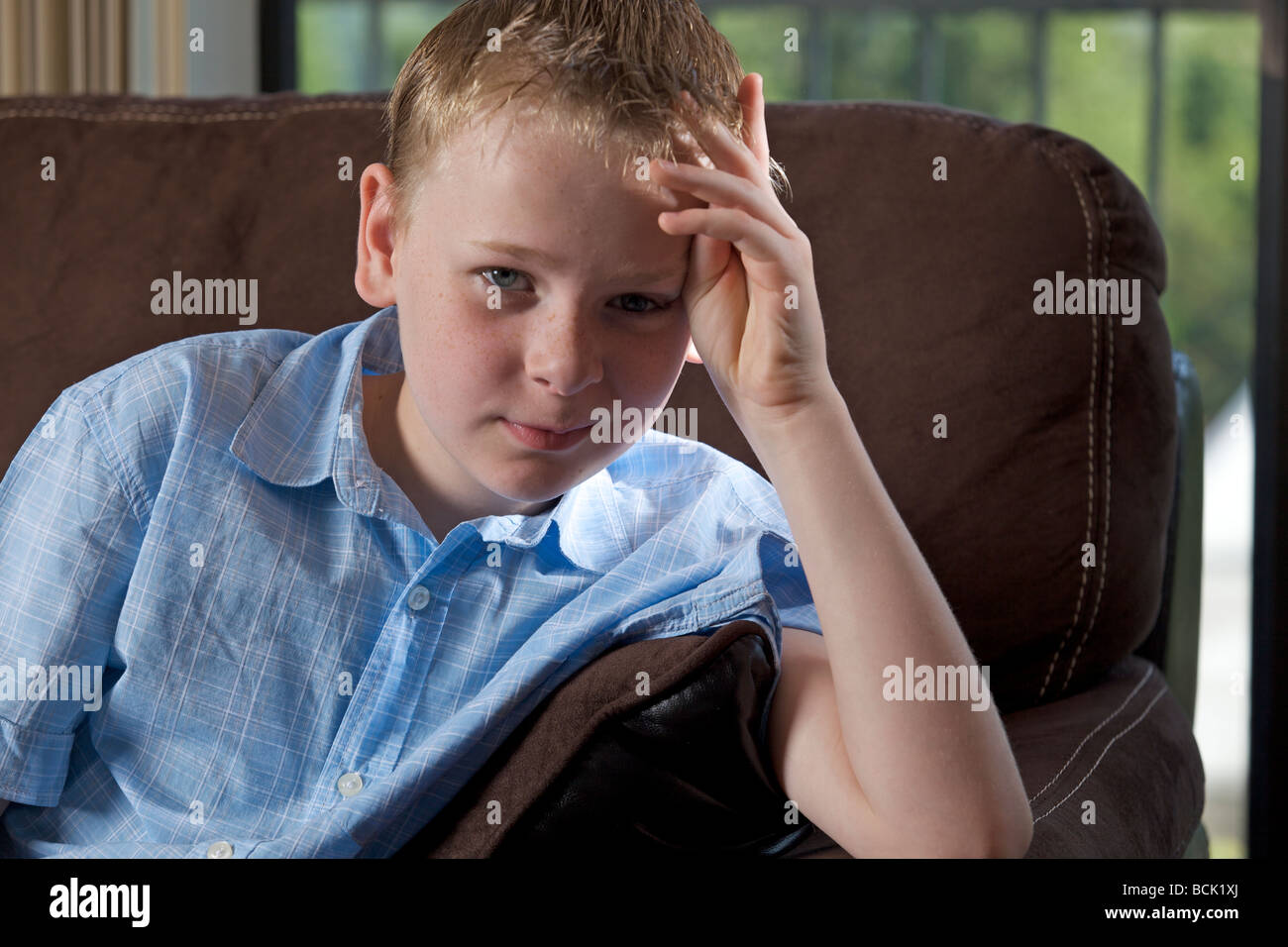 Portrait of a young boy at home Stock Photo - Alamy