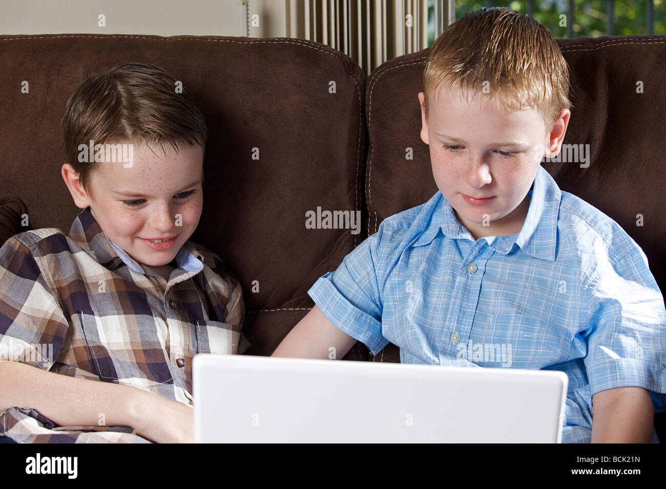 Siblings reading 8 9 years 5 6 years hi-res stock photography and ...