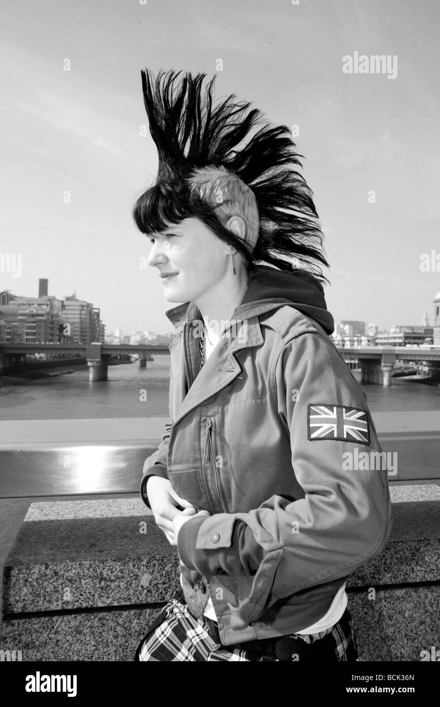 A punk girl 'Rae Ray Riots' with a large Mohican, London Bridge, London ...