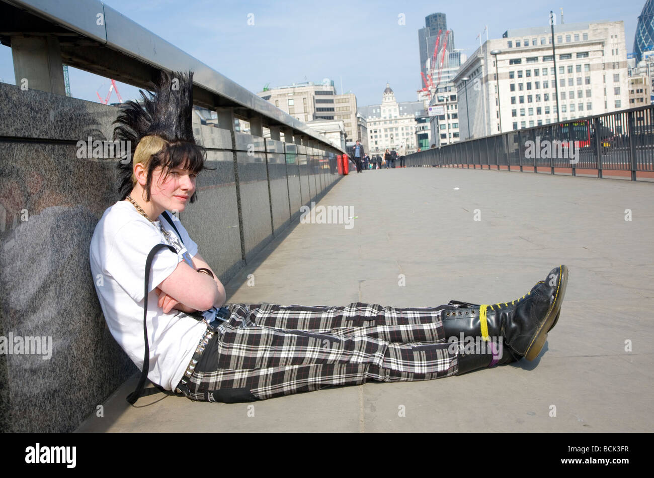 A punk girl Rae Ray Riots with a large Mohican, London Bridge, London ...