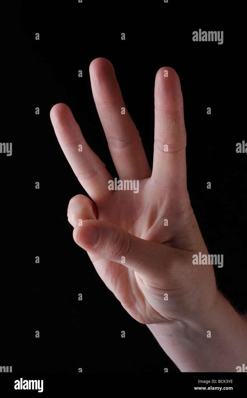 American Sign Language letter W Stock Photo - Alamy