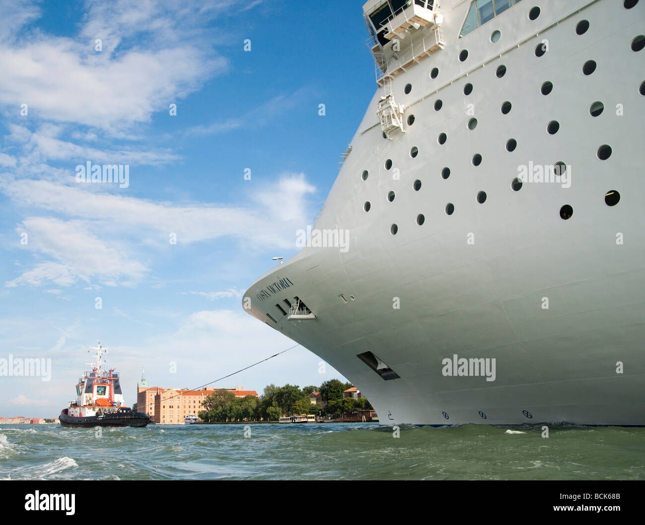 Venice - cruise liner Costa Victoria Genova being led by the pilot in a ...