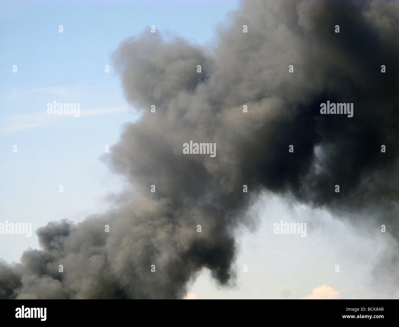 long black smoke trail in sky Stock Photo - Alamy