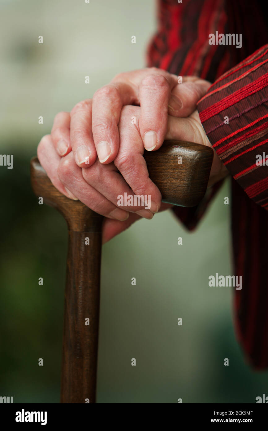 Old woman with a stick Stock Photo - Alamy