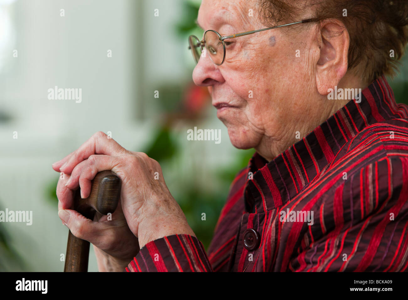 Old woman with a stick Stock Photo - Alamy