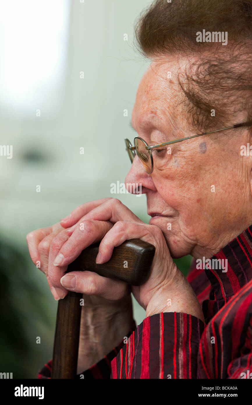 Old woman with a stick Stock Photo - Alamy