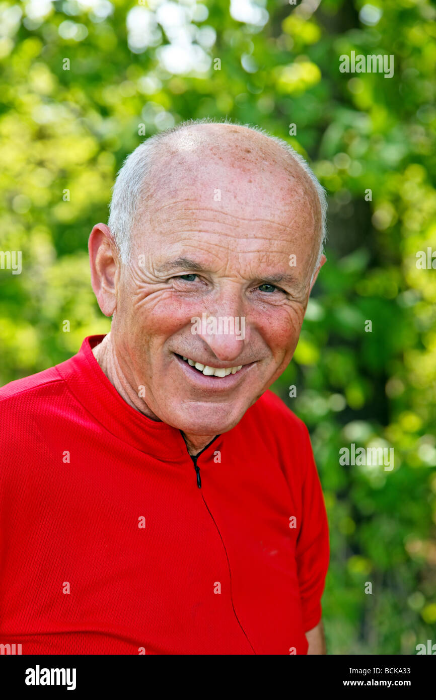 A senior portrait friendly smiles at the camera Stock Photo - Alamy