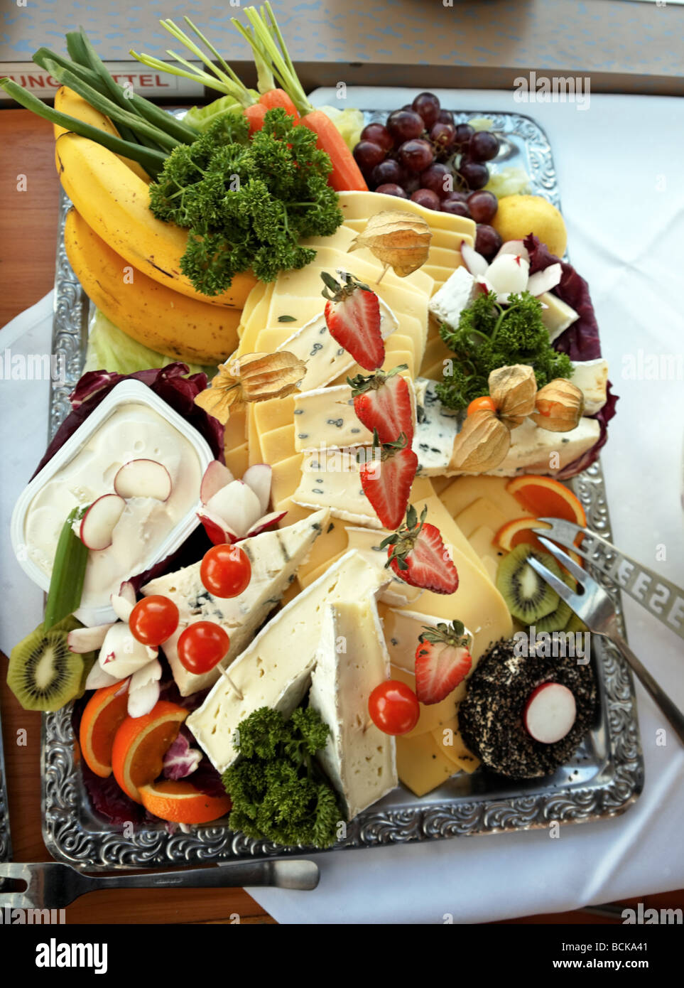 Cheese plate with a cold buffet Stock Photo - Alamy