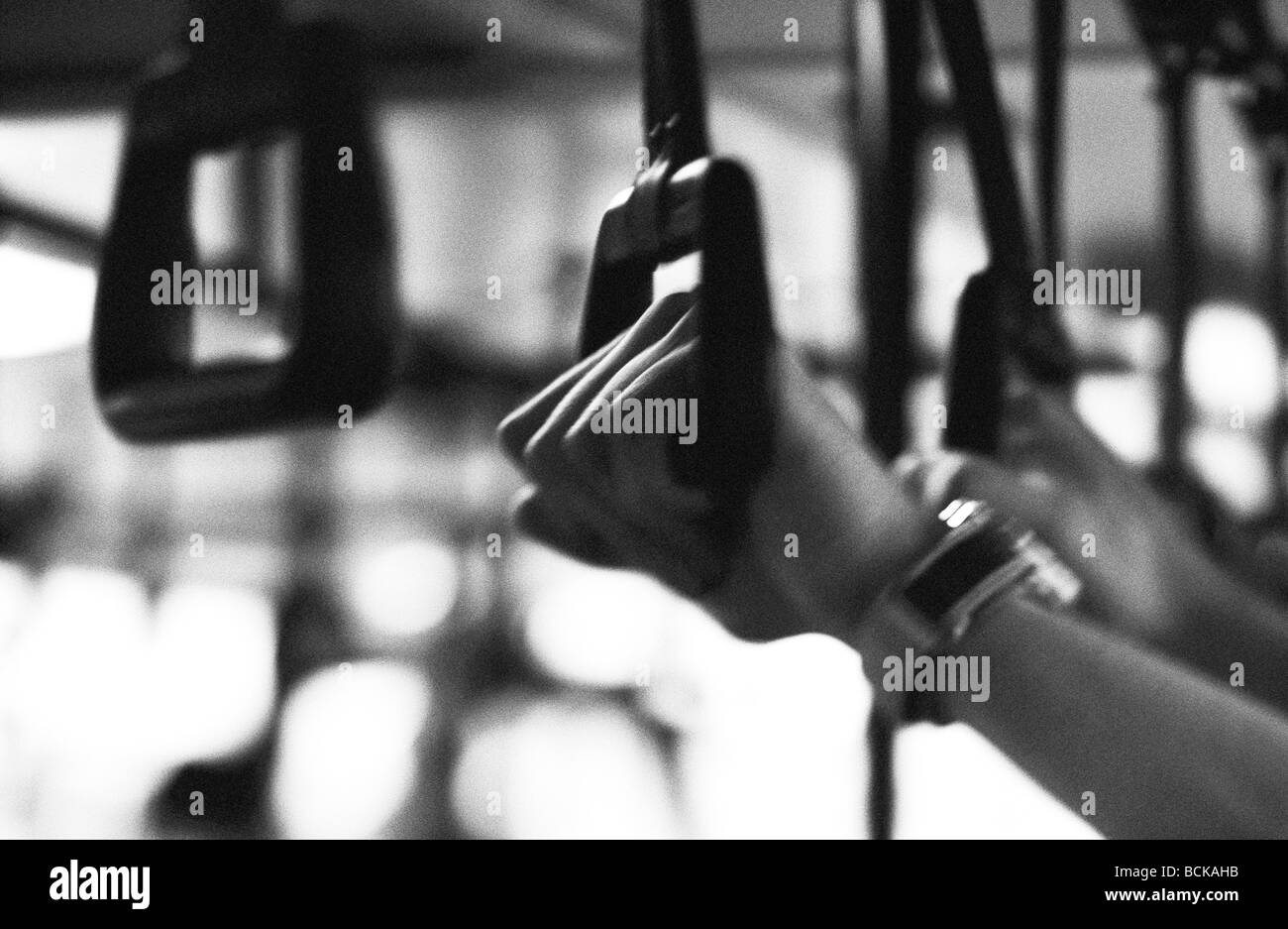 Person's hand holding grab handle, b&w Stock Photo - Alamy