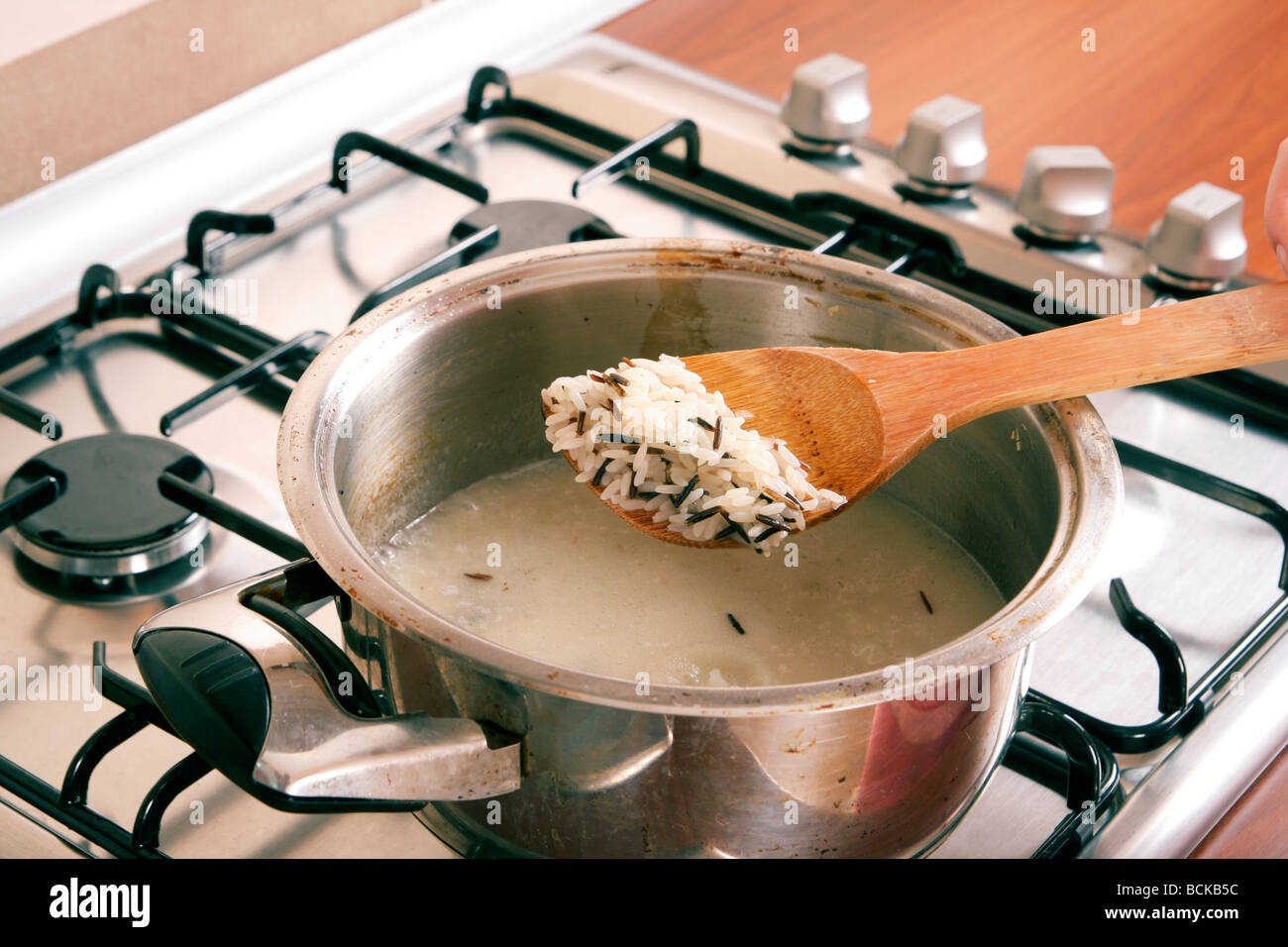 Cooking rice on the cooker Stock Photo - Alamy