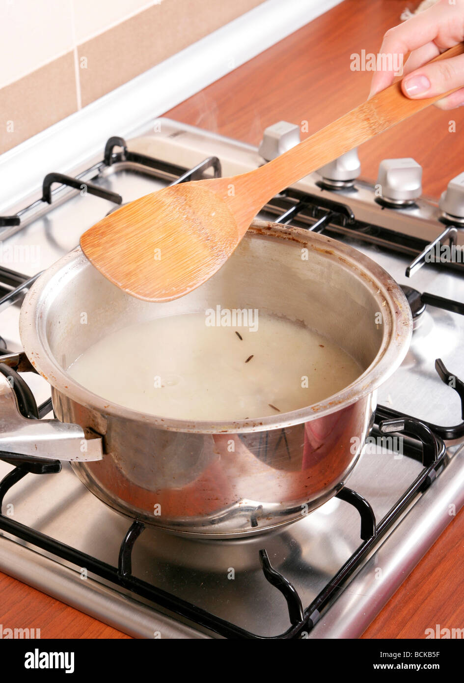 Cooking rice on the cooker Stock Photo - Alamy