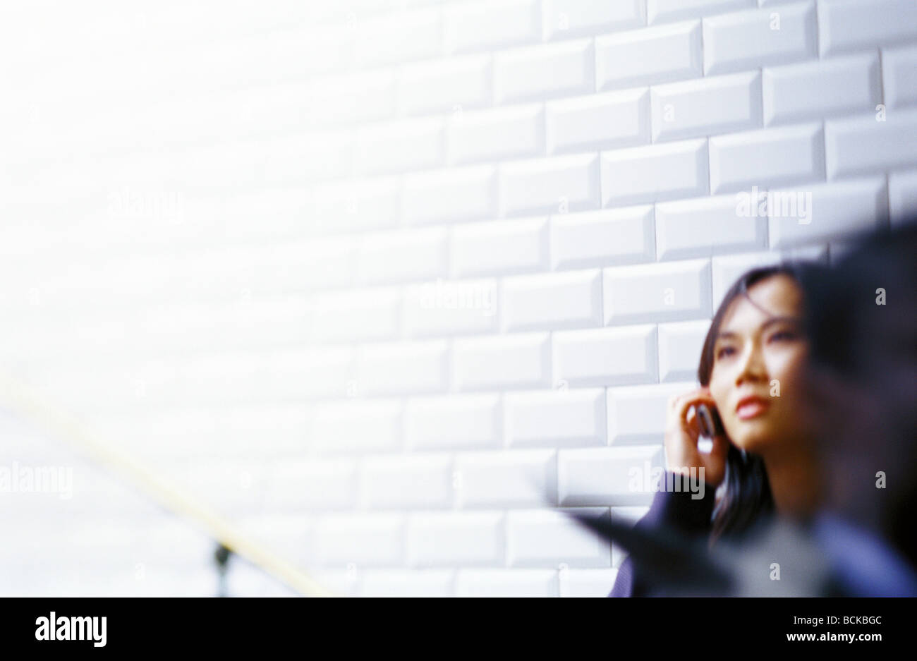 Leaning on tiled wall hi-res stock photography and images - Alamy
