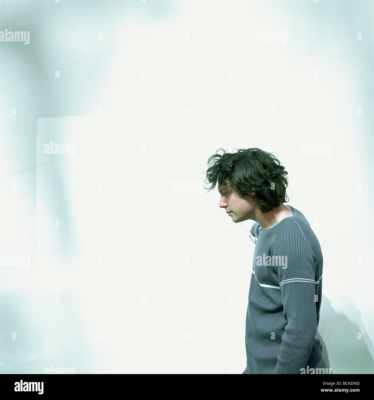 Young man, side view Stock Photo - Alamy