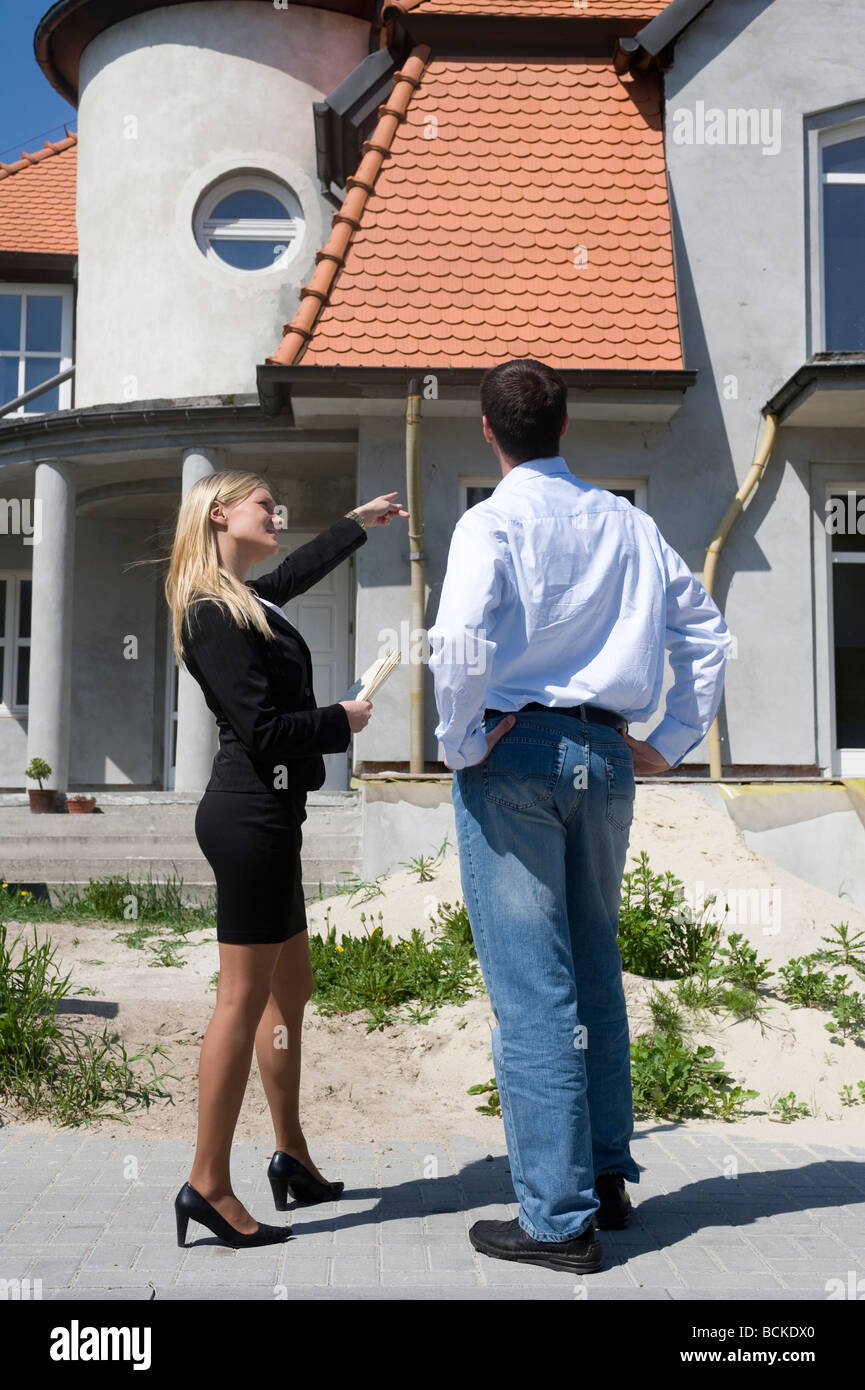 Developer with man standing at new home Stock Photo - Alamy