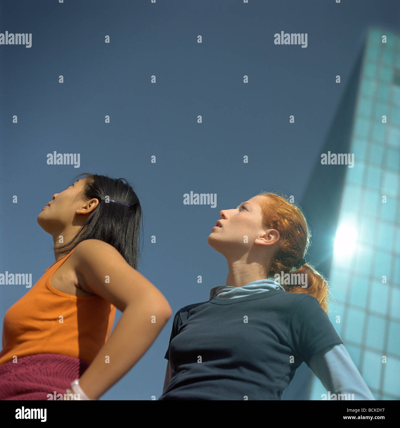 Young women, low angle view Stock Photo - Alamy