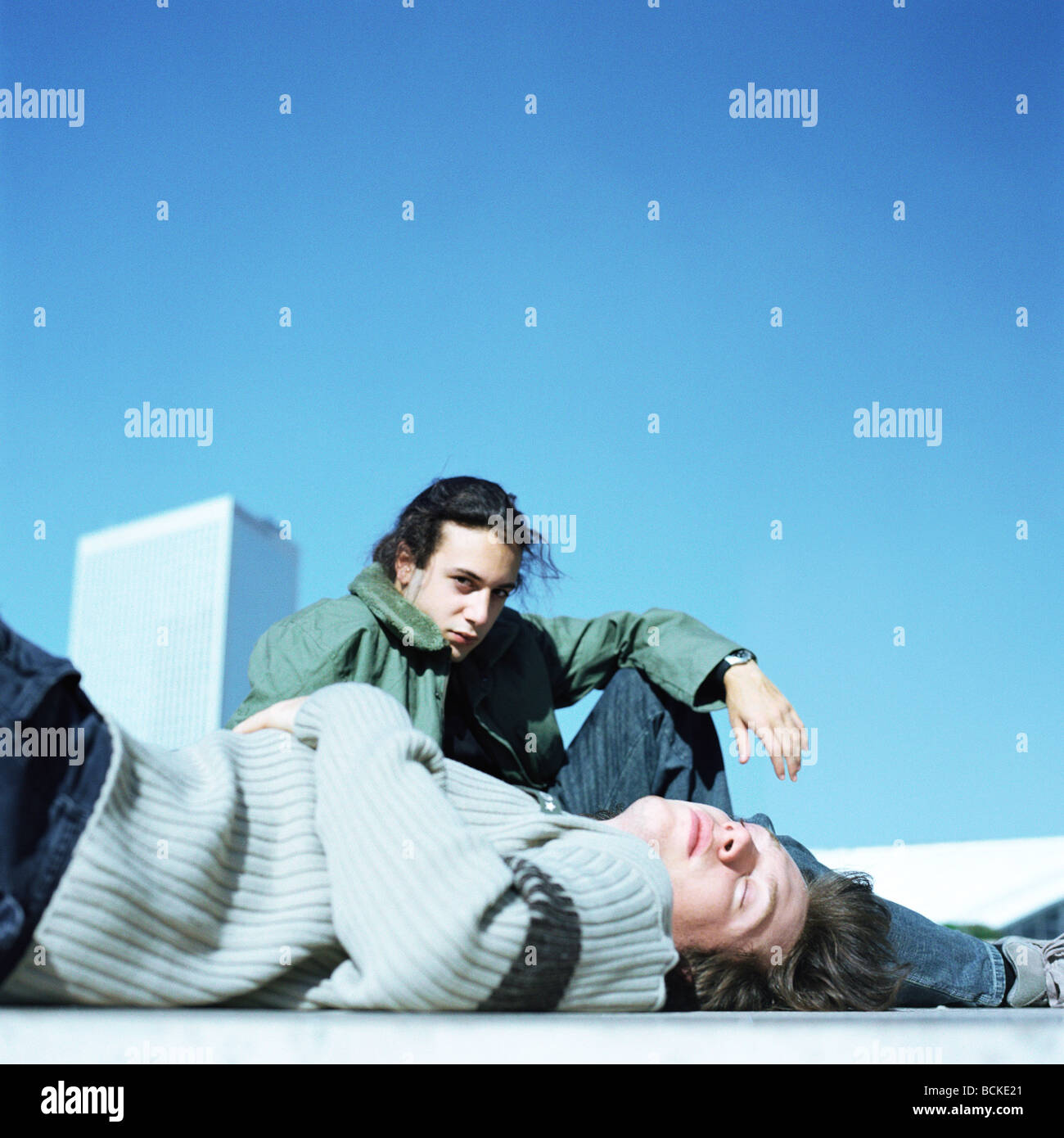Urban scene, young people on ground Stock Photo - Alamy