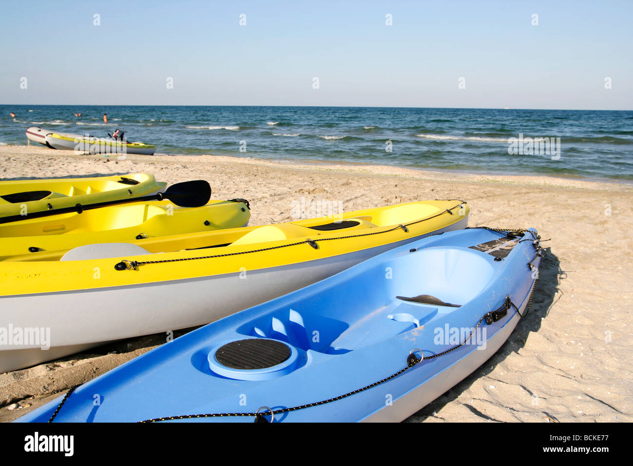 Canoe on an empty beach Stock Photo - Alamy