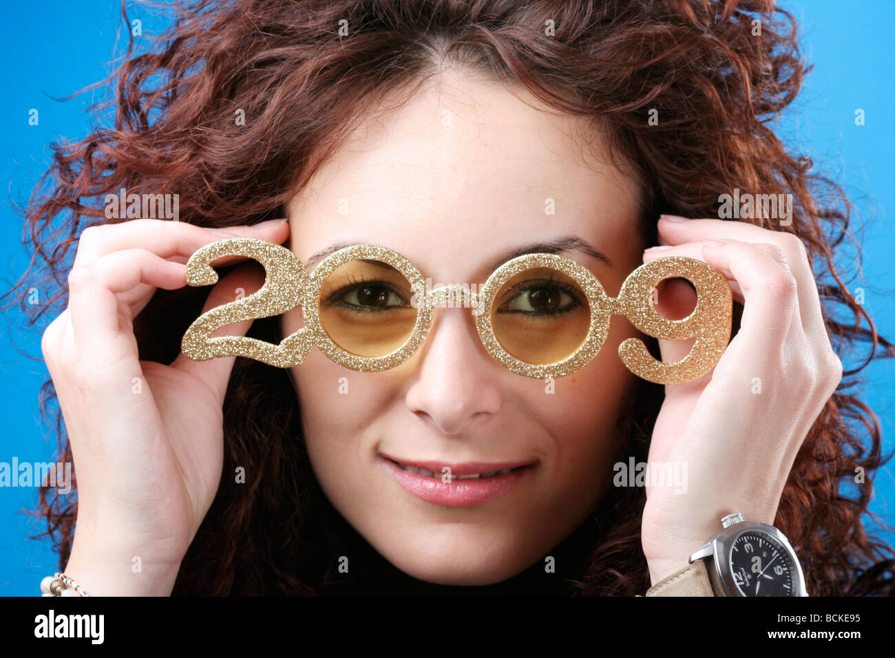 Beautiful woman celebrating the new year Stock Photo - Alamy