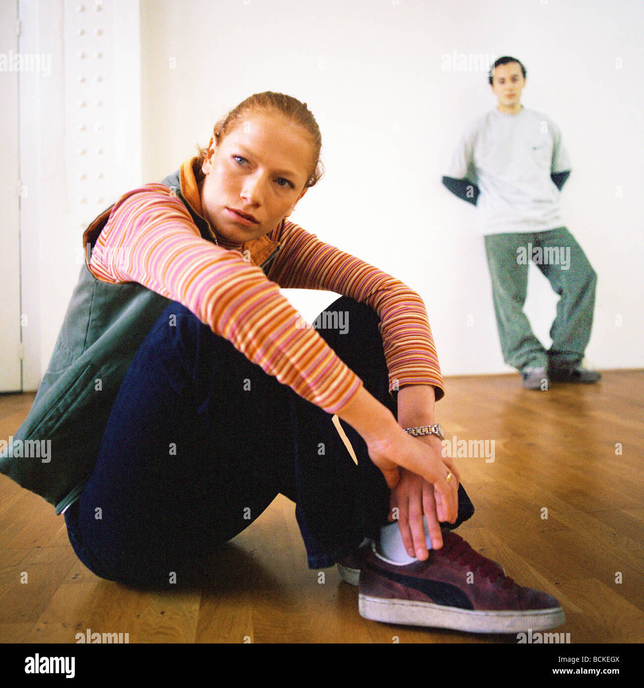 Girl Sitting Against Wall Stock Photos & Girl Sitting Against Wall ...