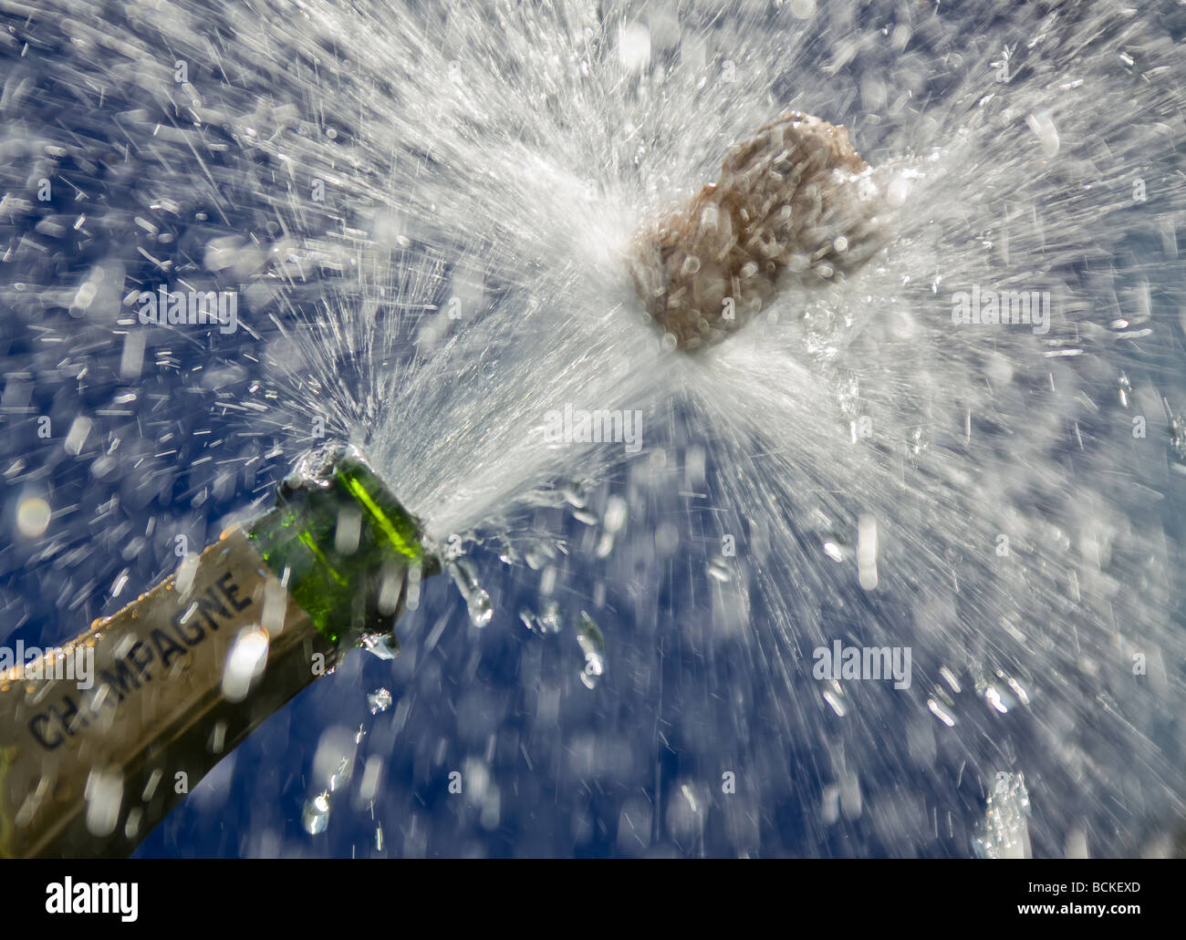 popping cork of an open champagne bottle Stock Photo - Alamy