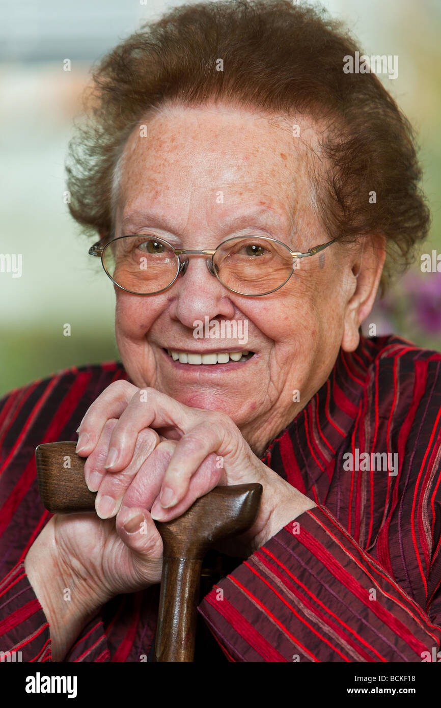 Old woman with a stick Stock Photo - Alamy