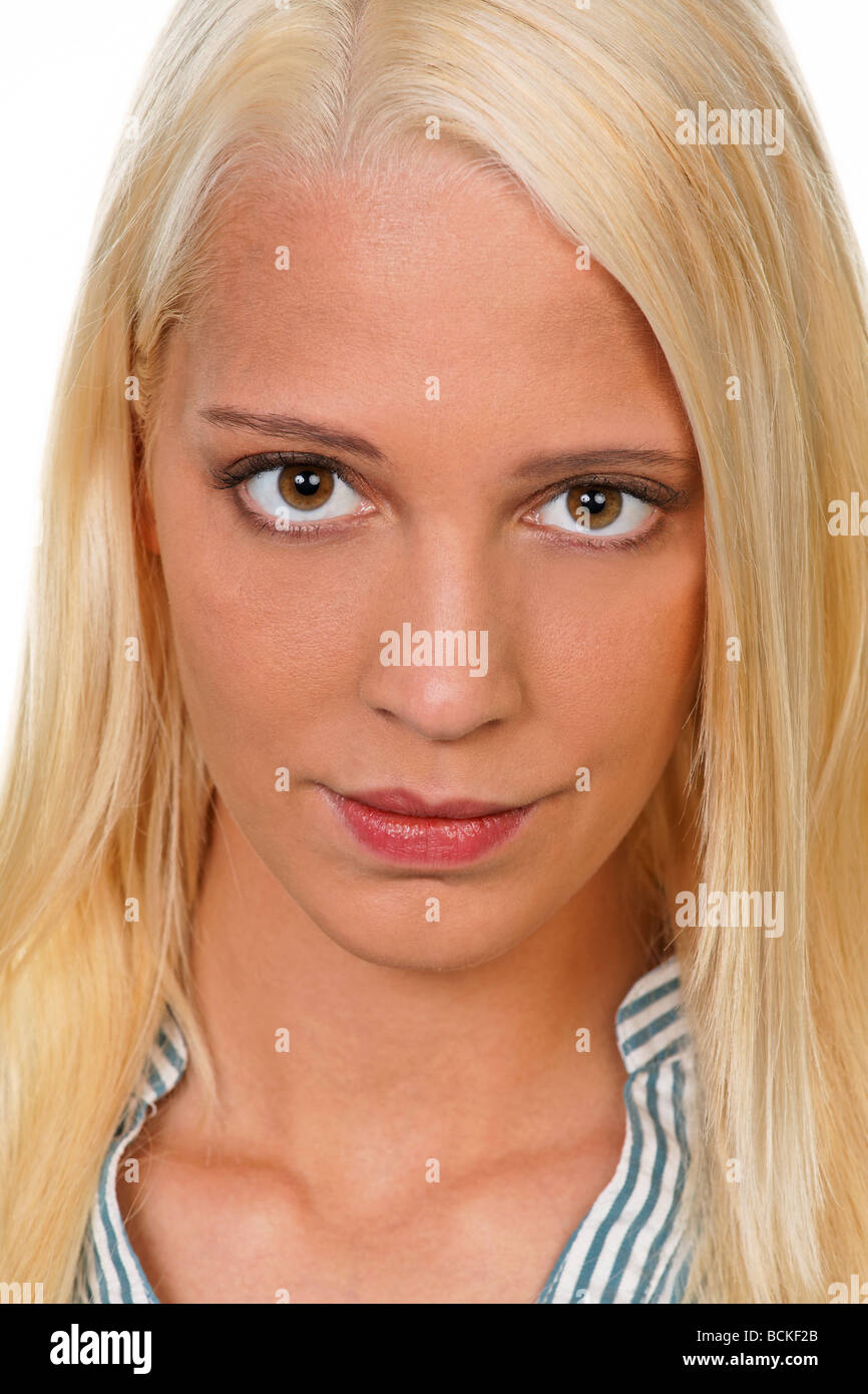 Young woman smiling seriously with a skeptical facial expression Stock ...