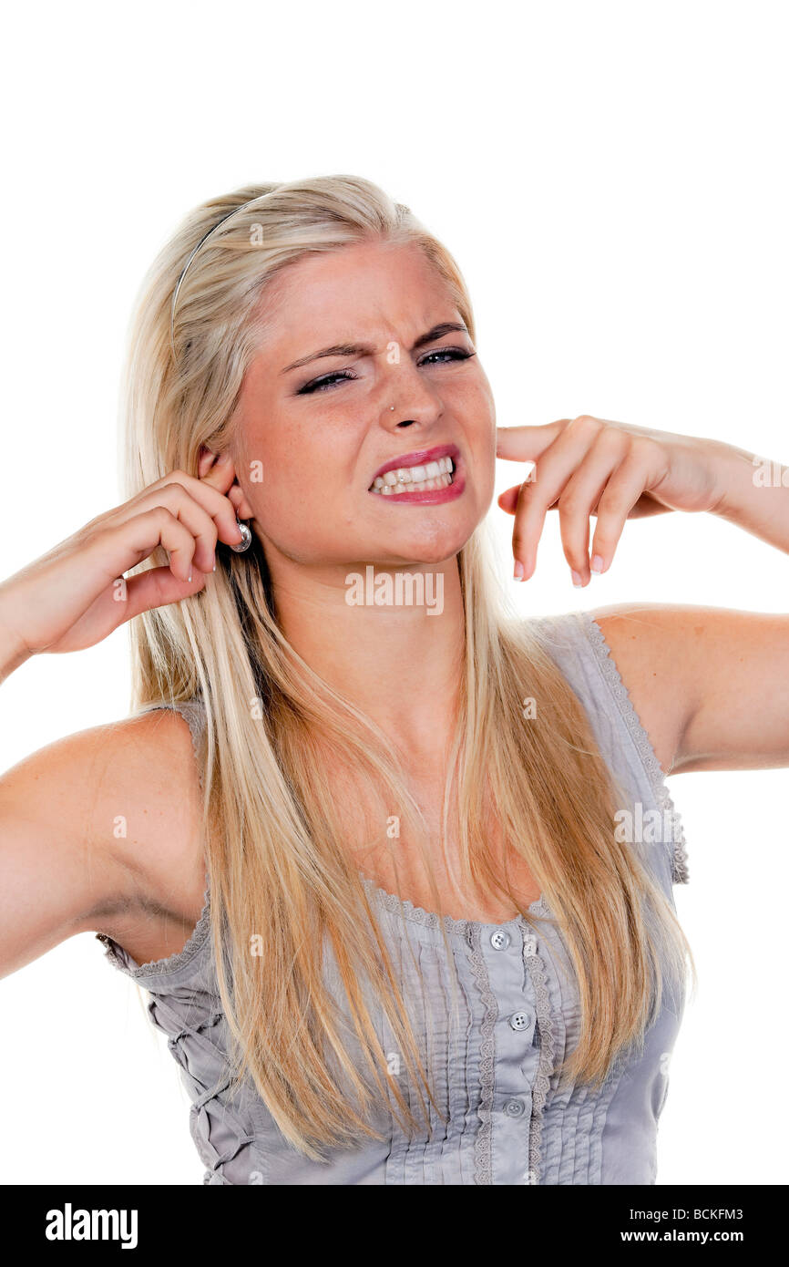 young woman suffering from noise, keeping ears shut Stock Photo - Alamy