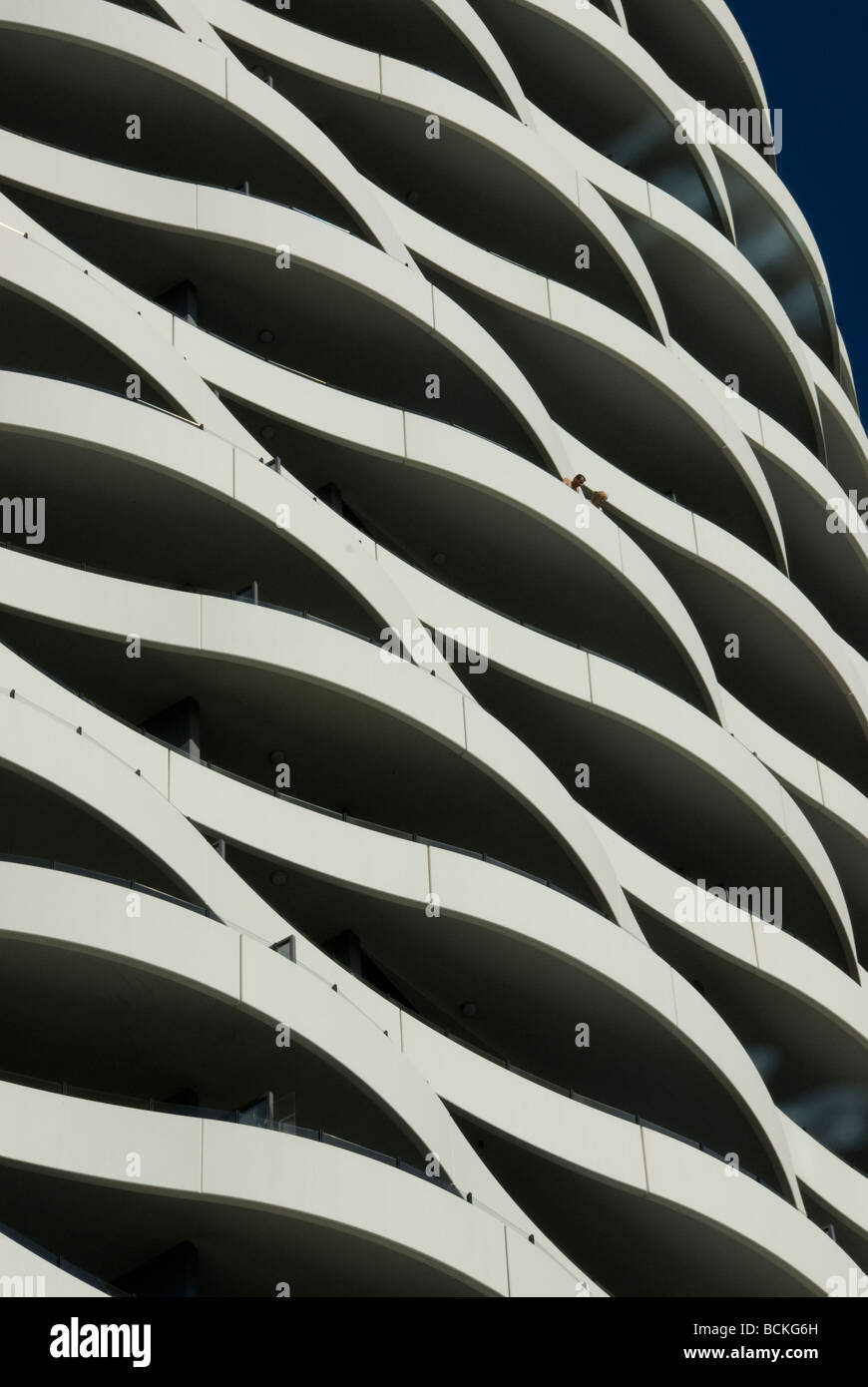 Curved balconies of apartments, tower block, high rise building ...