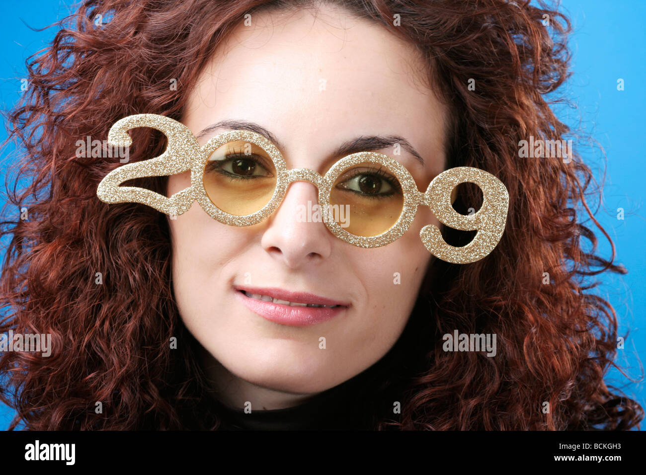 Beautiful woman celebrating the new year Stock Photo - Alamy