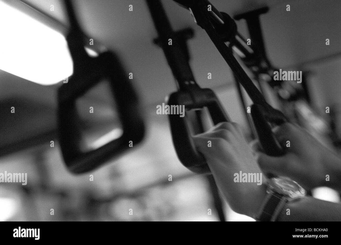 Two hands holding bus handles hi-res stock photography and images - Alamy