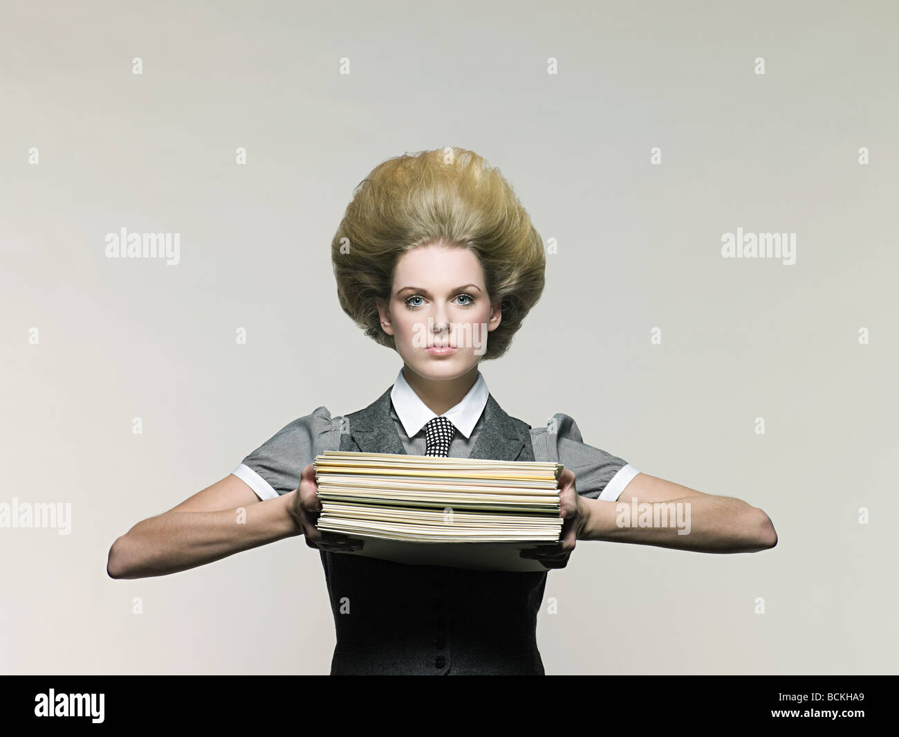 Businesswoman holding files Stock Photo - Alamy