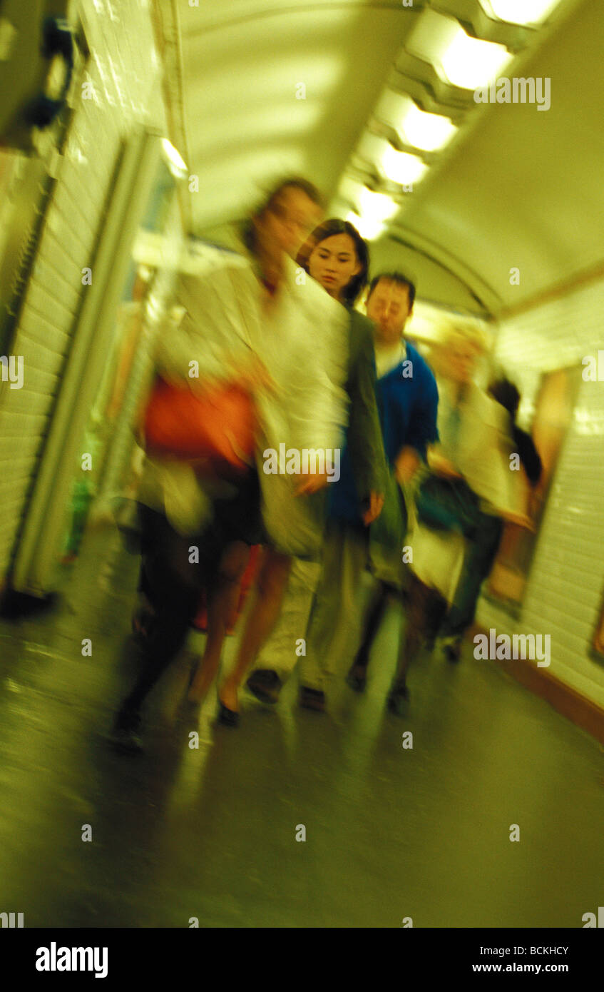People walking through corridor Stock Photo - Alamy