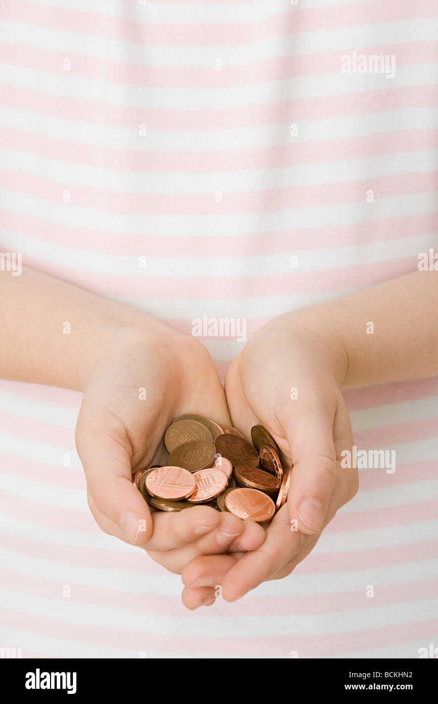 Handful of coins Stock Photo - Alamy