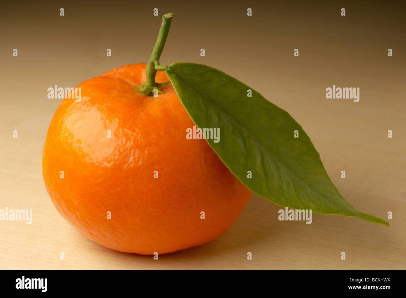 Mandarin on brown background Stock Photo - Alamy