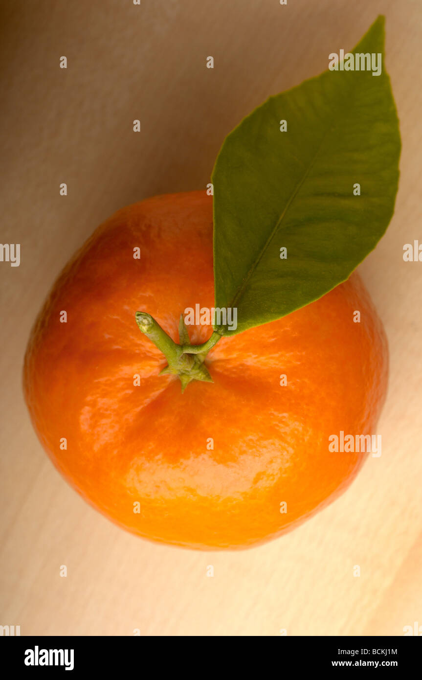 Mandarin on brown background Stock Photo - Alamy