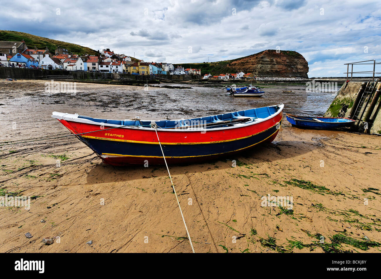 Boat (Coble) on the beach at Staithes in North Yorkshire Stock Photo ...